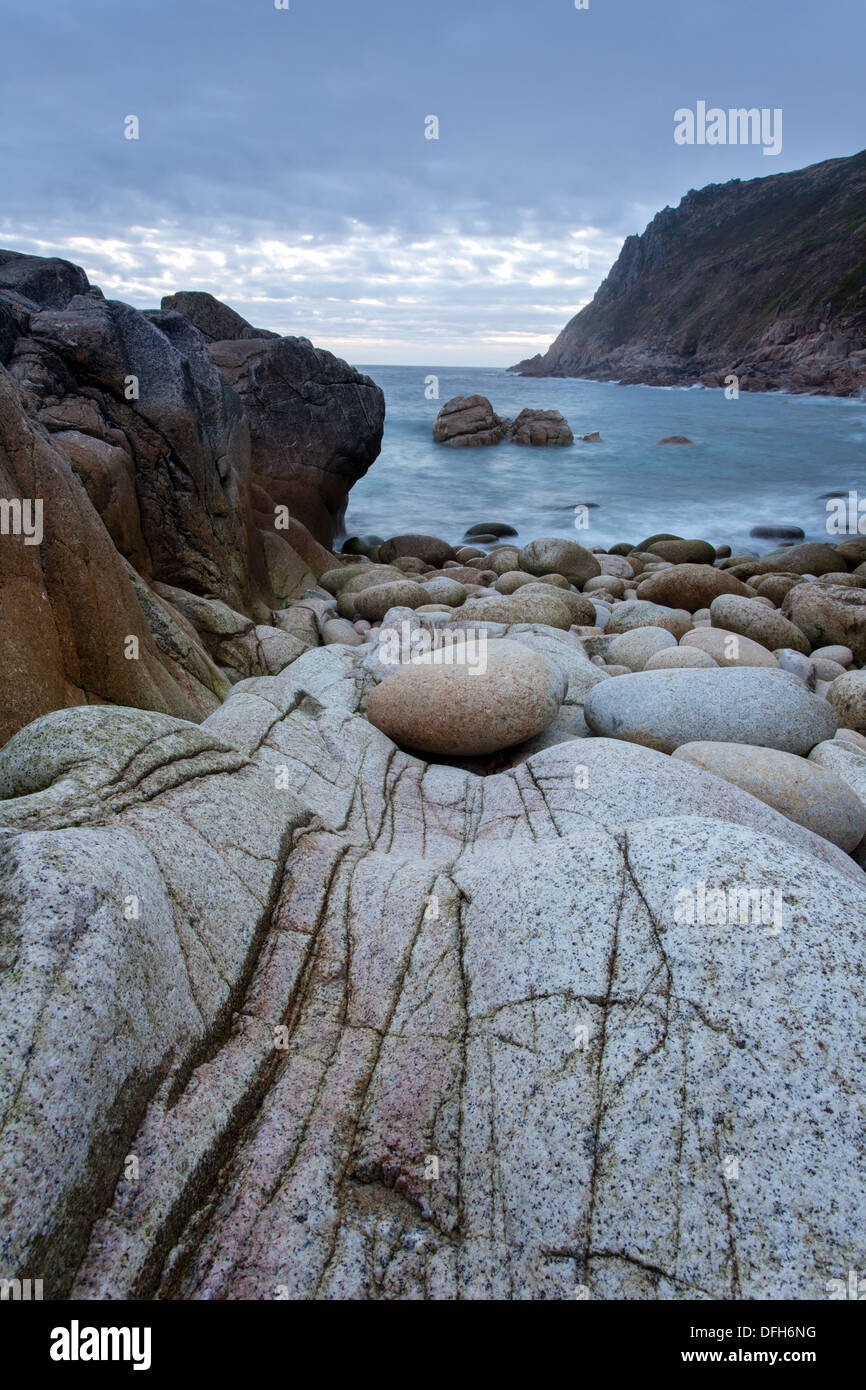 Porth Nanven granite rocks and shore leading down to the boulder strewn ...