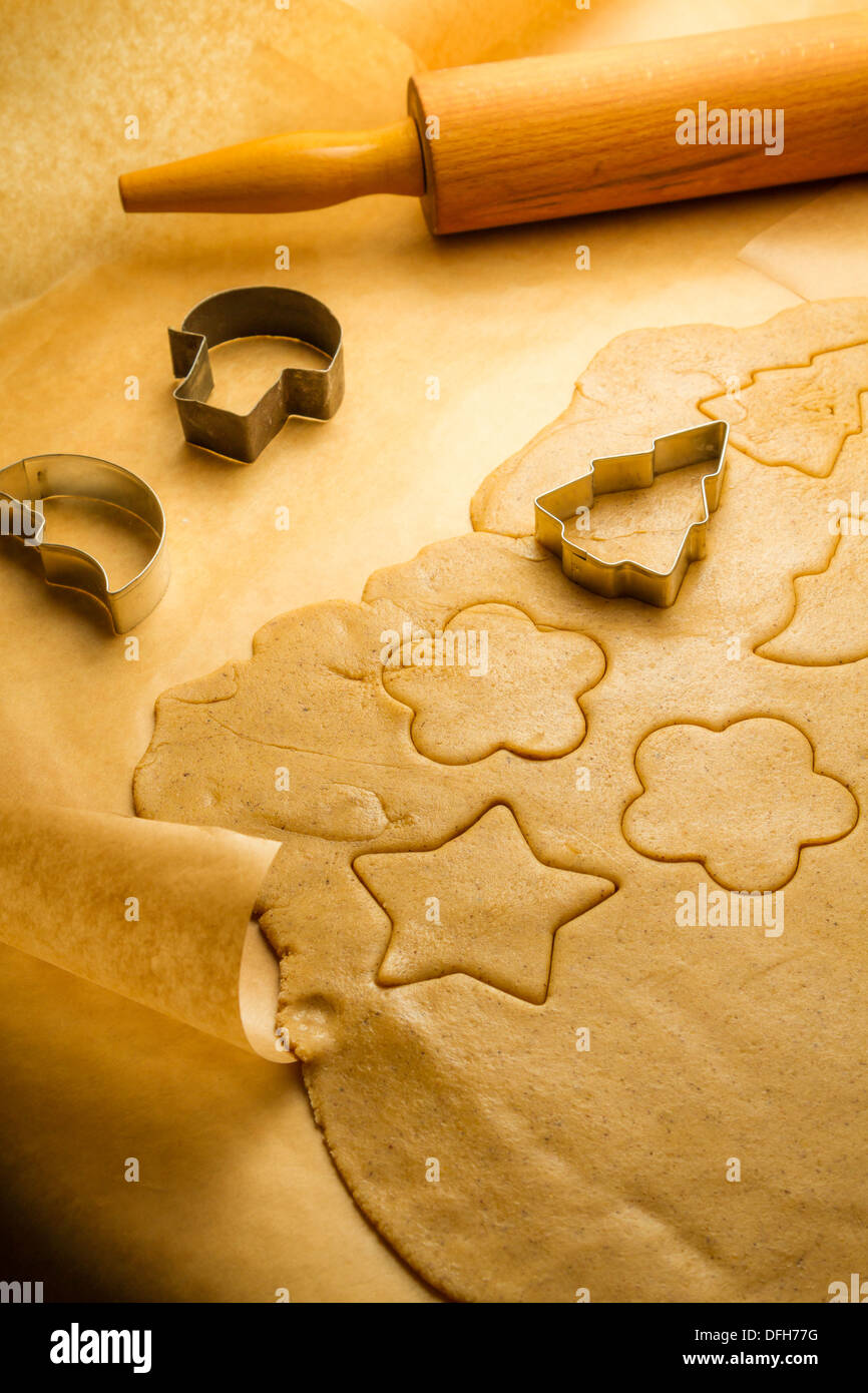 Cutting of different shapes of gingerbread cookies Stock Photo - Alamy