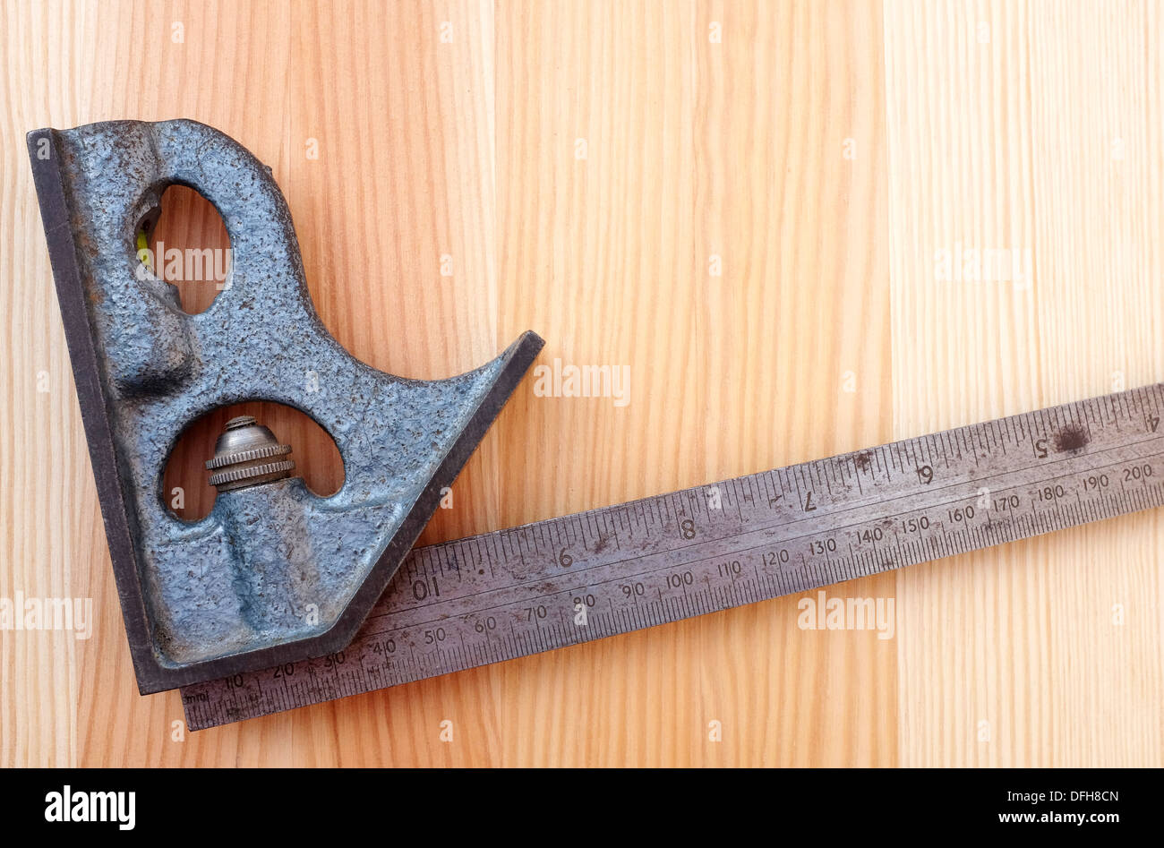 Closeup of metal set square on a wood grain background Stock Photo - Alamy