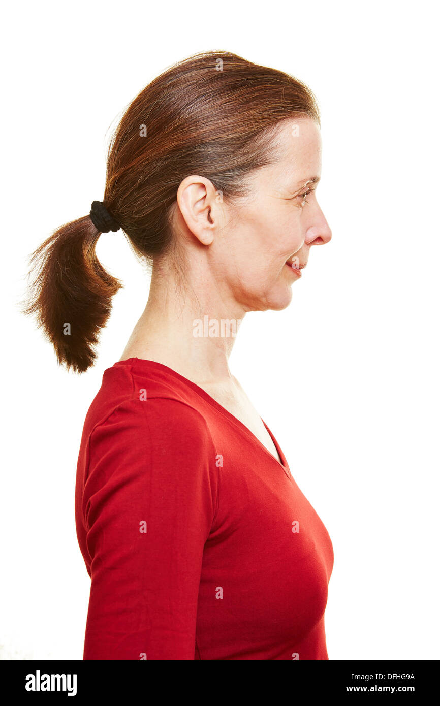Senior woman in profile view with ponytail Stock Photo - Alamy