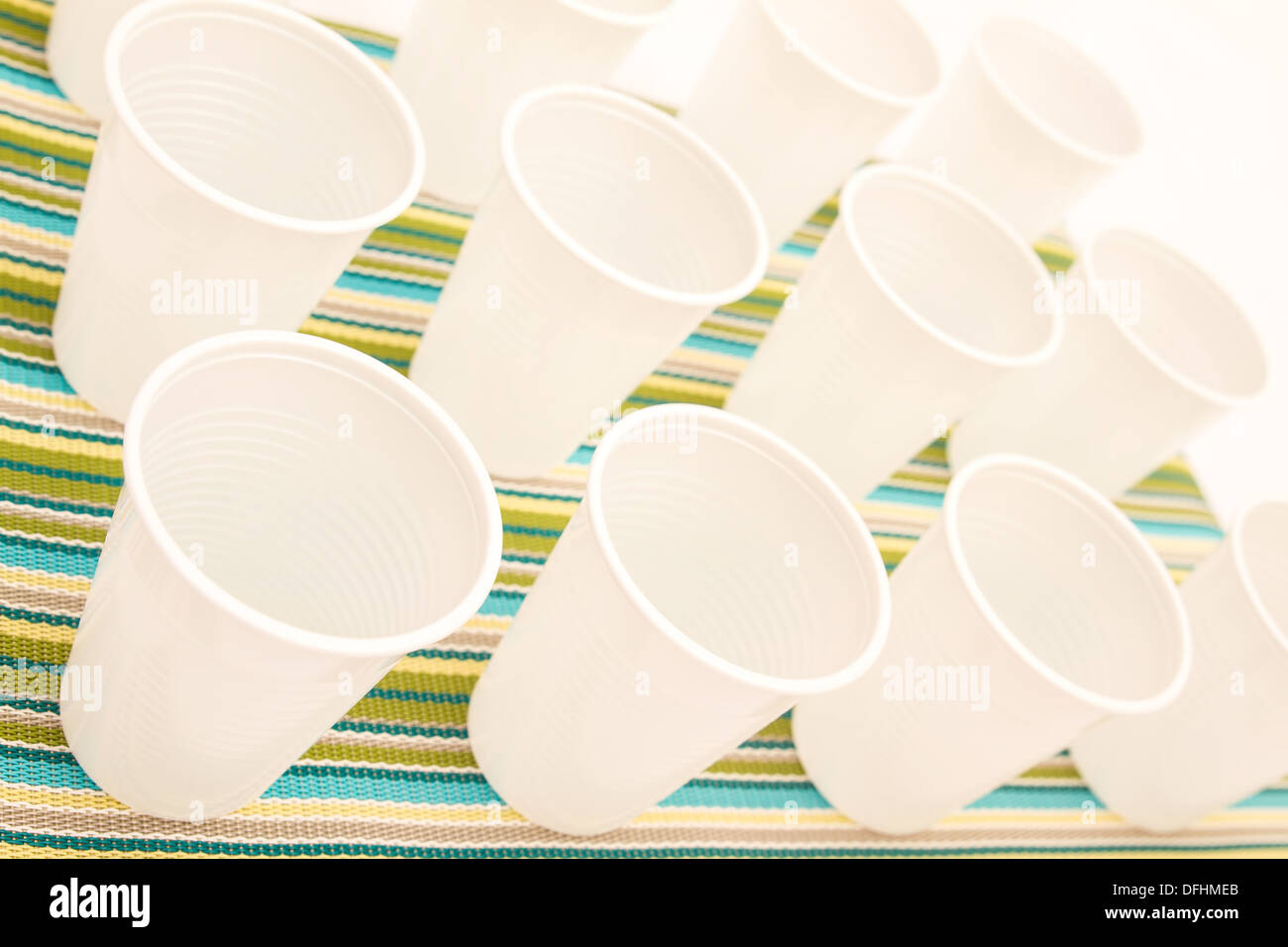 Lots of disposable cups on a colorful background Stock Photo - Alamy
