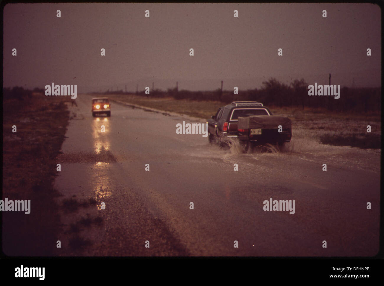 Heavy rain causes flooding on a road, disrupting travel and ...