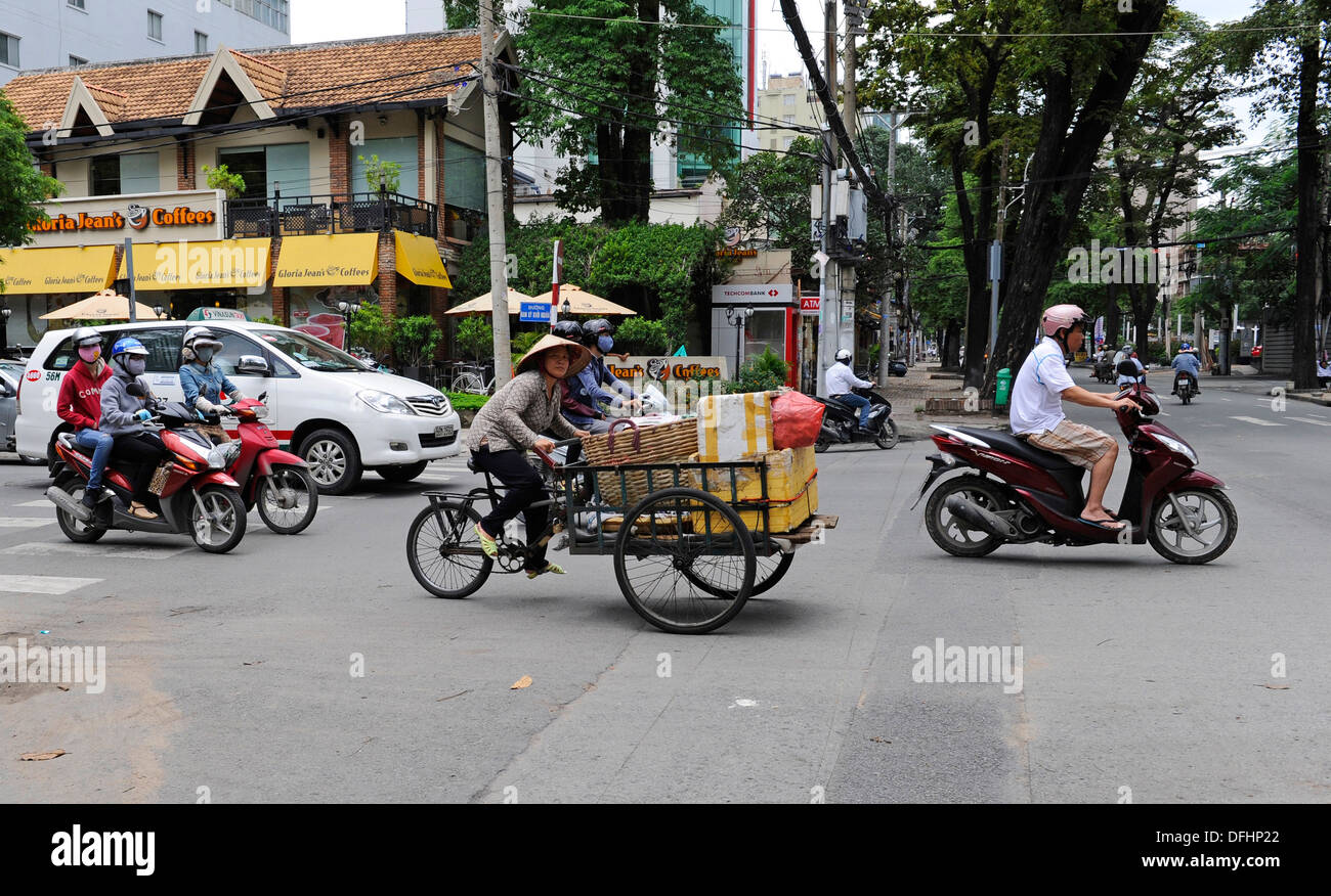 Over loaded tri-cycles with large boxes being cycled on the busy ...