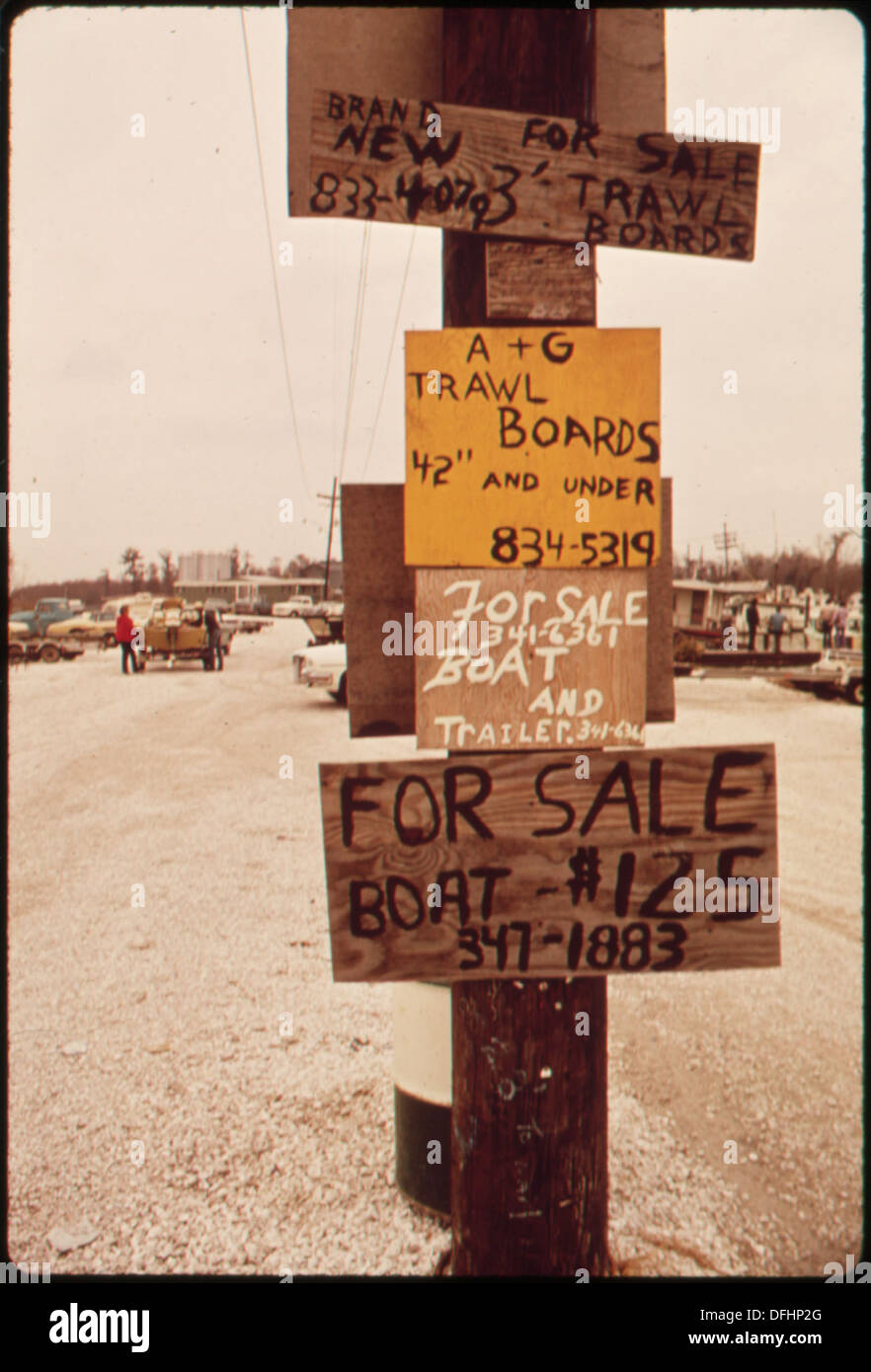 This image shows homemade signs placed at a public boat launch. These ...