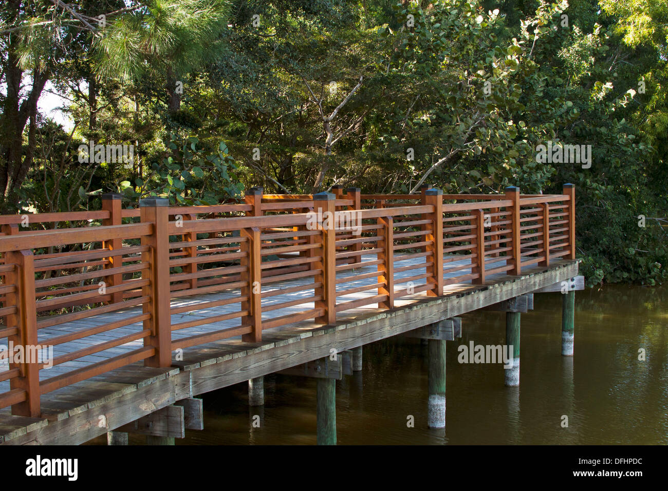 Wooden footbridge over a garden pond hi-res stock photography and ...