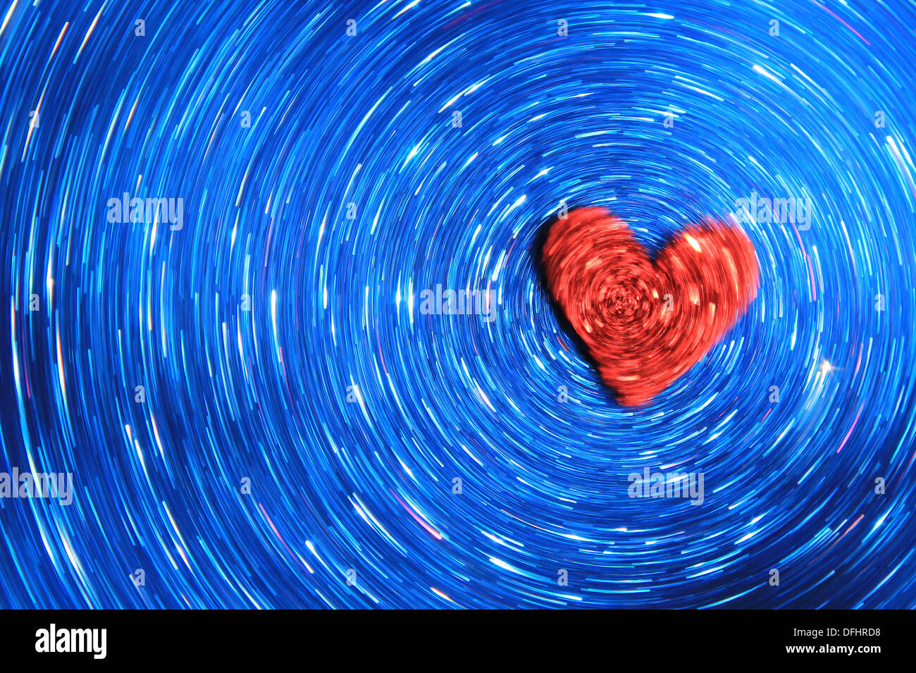 Love and Romance - Red Heart Swirl through a Galaxy of Blue Stock Photo ...