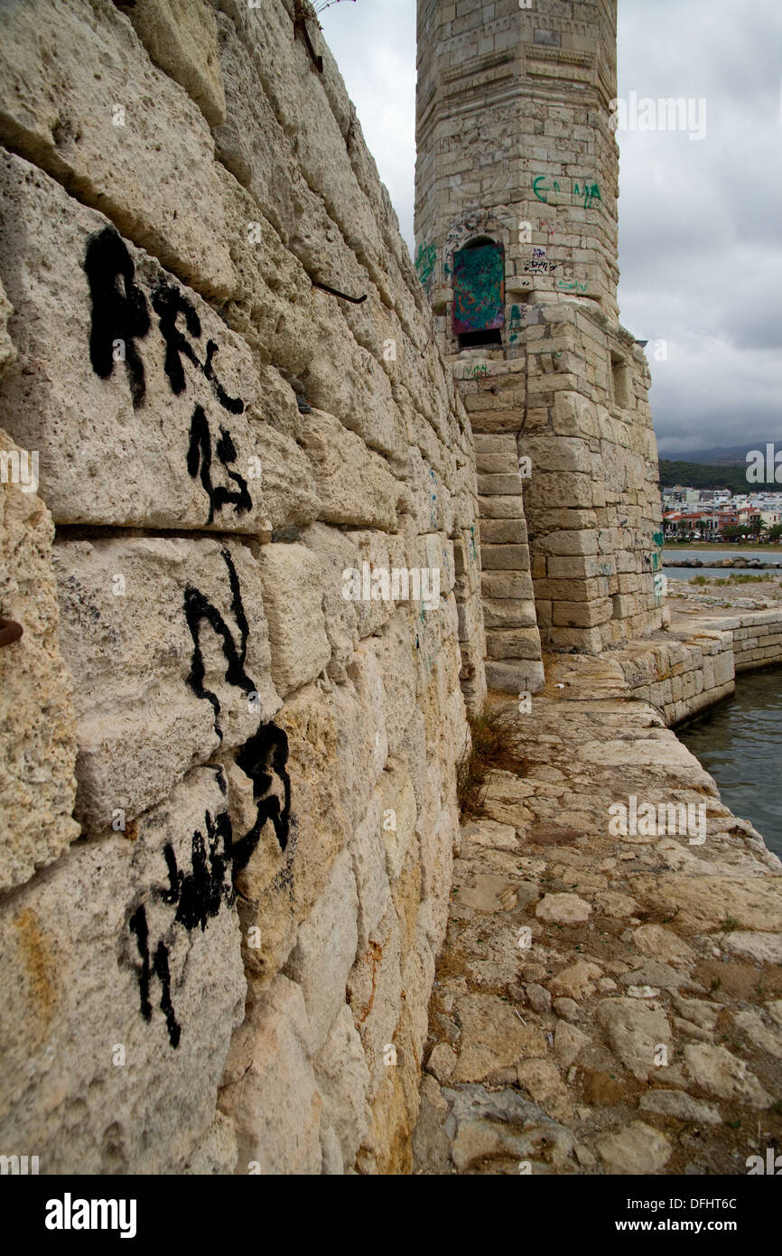 Graffiti on wall of lighthouse in Rethymno Harbour, Crete, Greece Stock ...