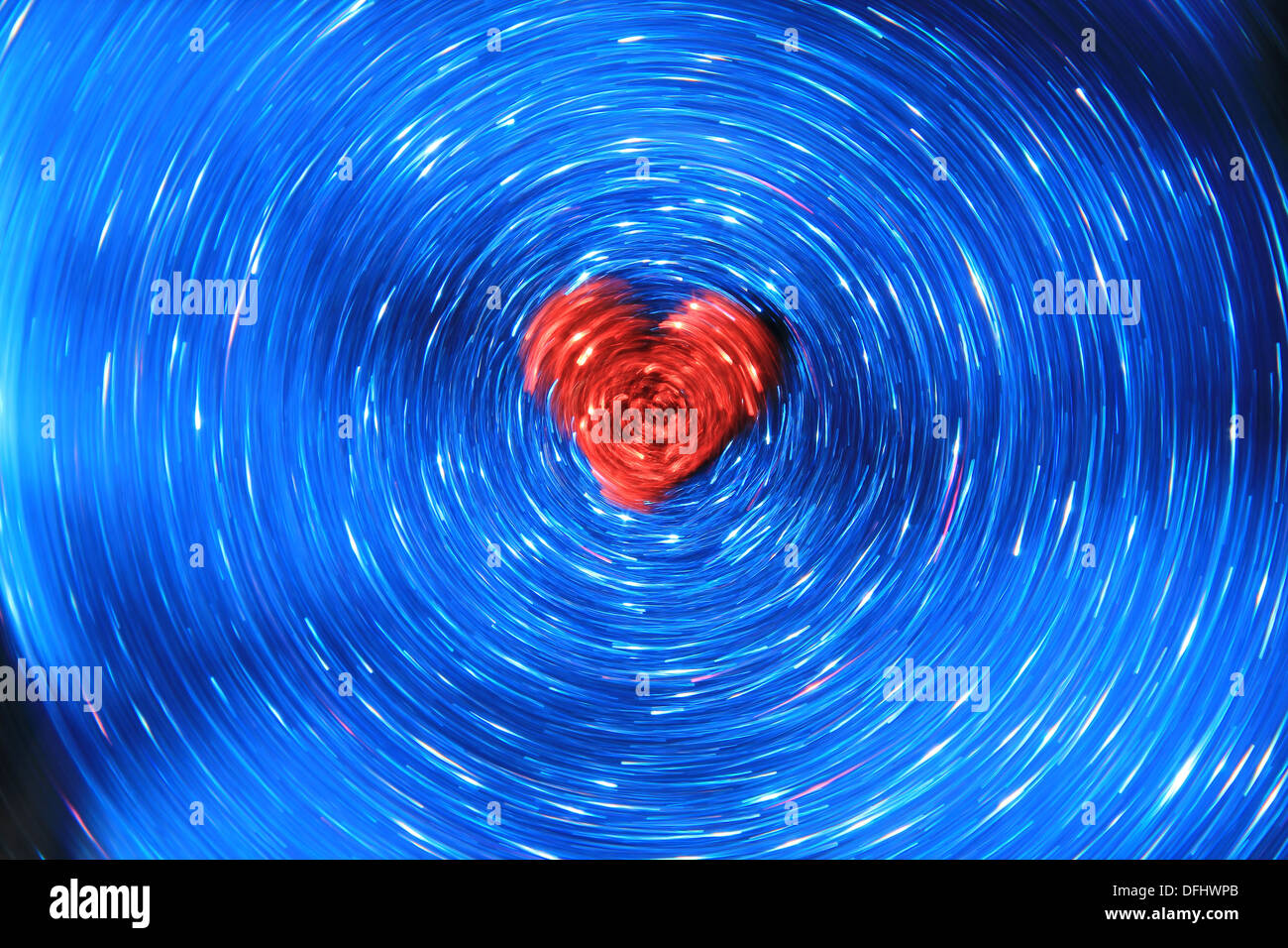 Love and Romance - Red Heart Swirl through a Galaxy of Blue Stock Photo ...