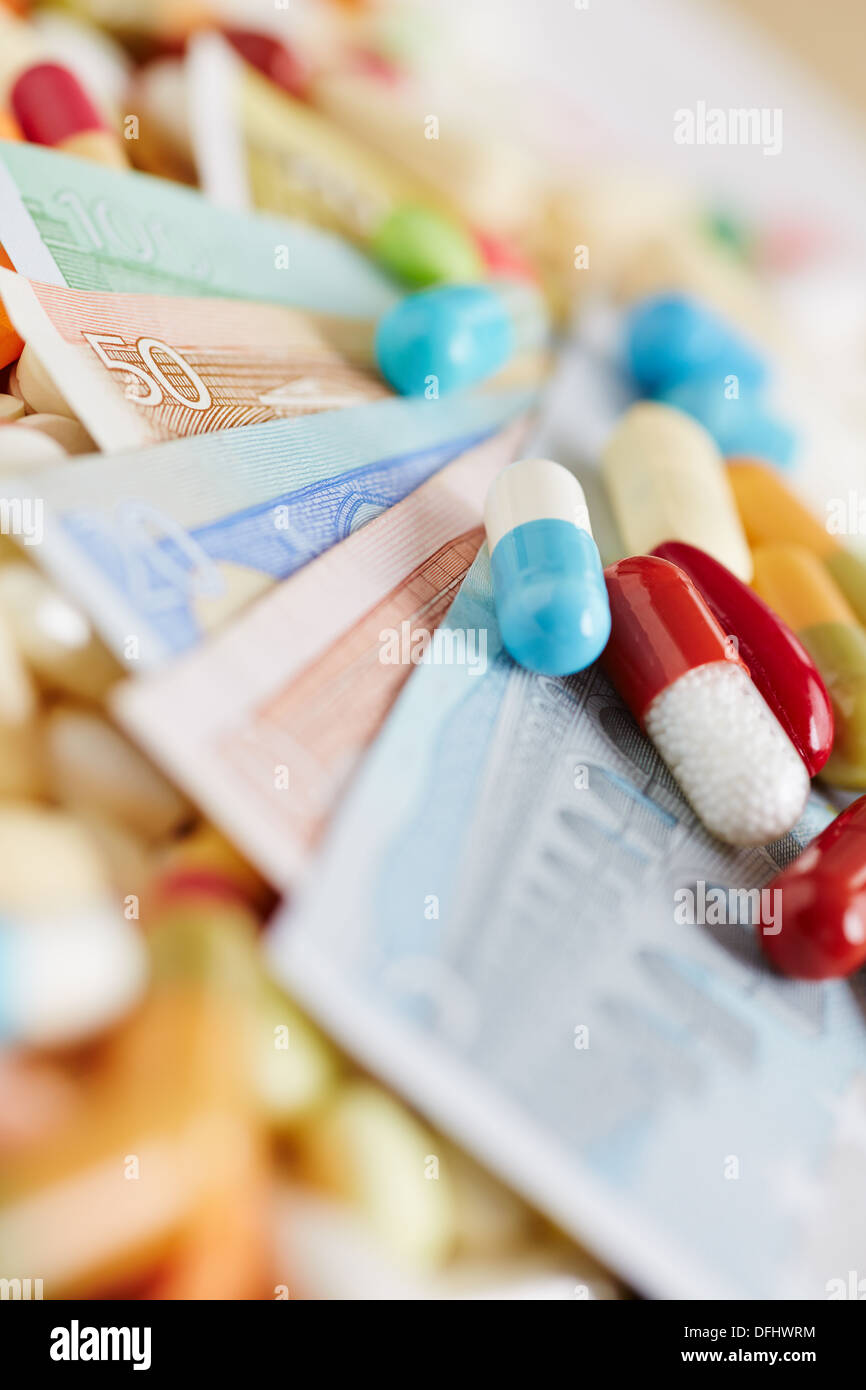 Medicine and Euro money bills with colorful different medication Stock ...