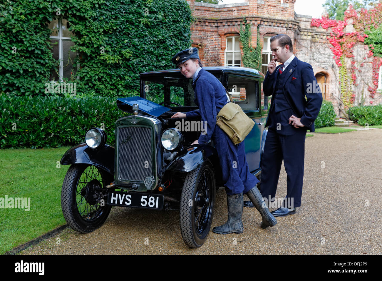 Sorrel Gilbert dressed as a 1943 working WAF fixes an Austin 7 with a ...