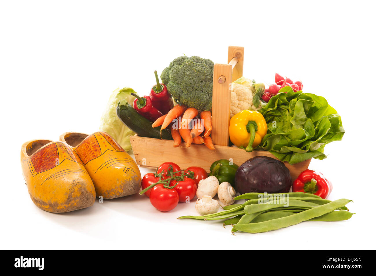 Wooden basket with fresh vegetables and typical Dutch clogs Stock Photo ...
