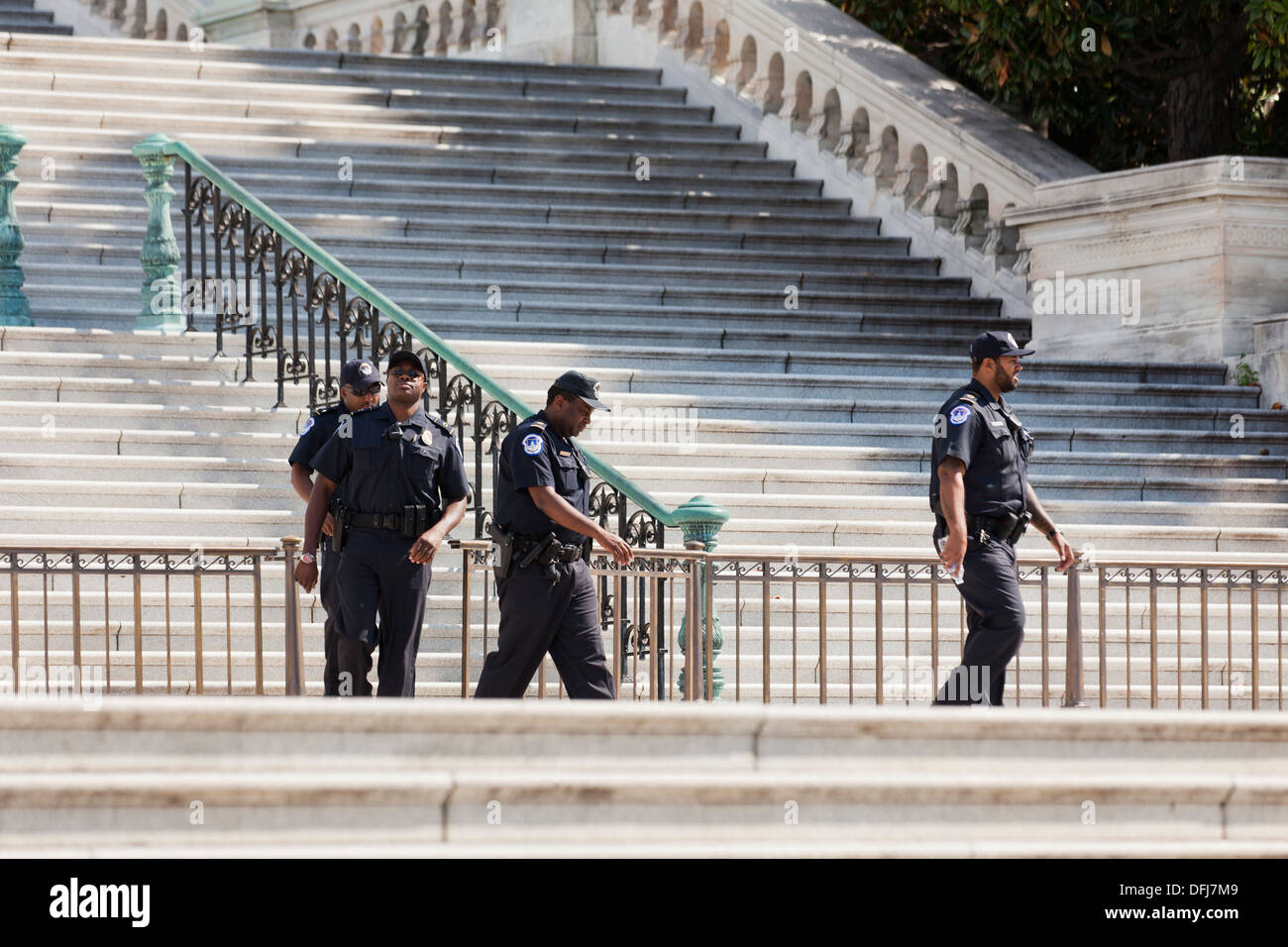 US Capitol Police officers walking down steps of the Capitol building ...