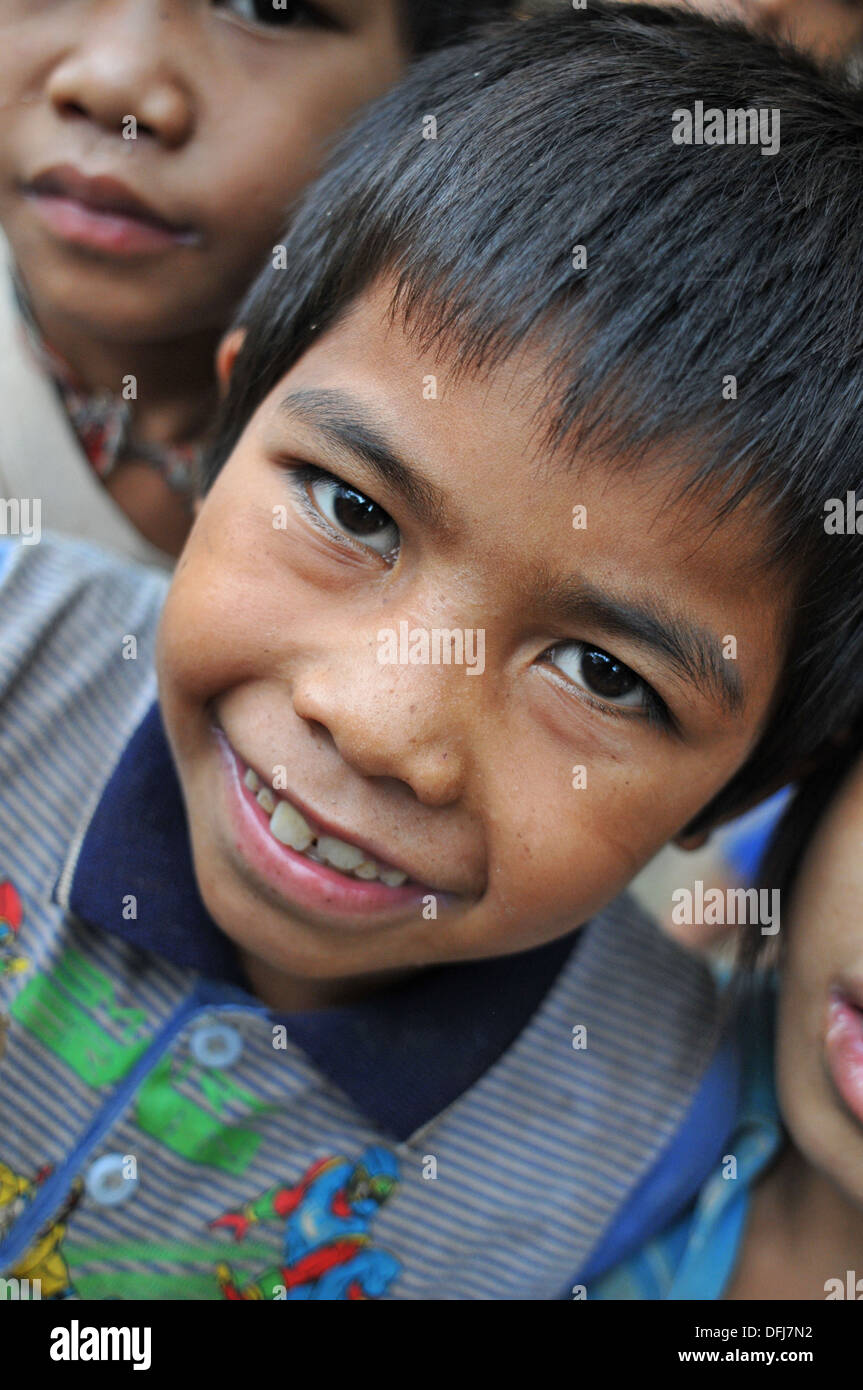 Lao boy at Pak Ou Cave in Luang Prabang, Laos Stock Photo - Alamy