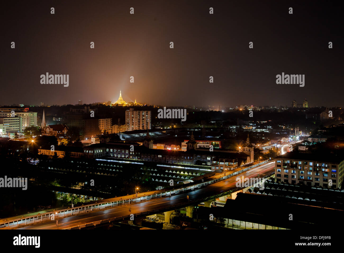 Yangon at night. Shwedagon pagoda on the horizon. Cityscape Landscape ...