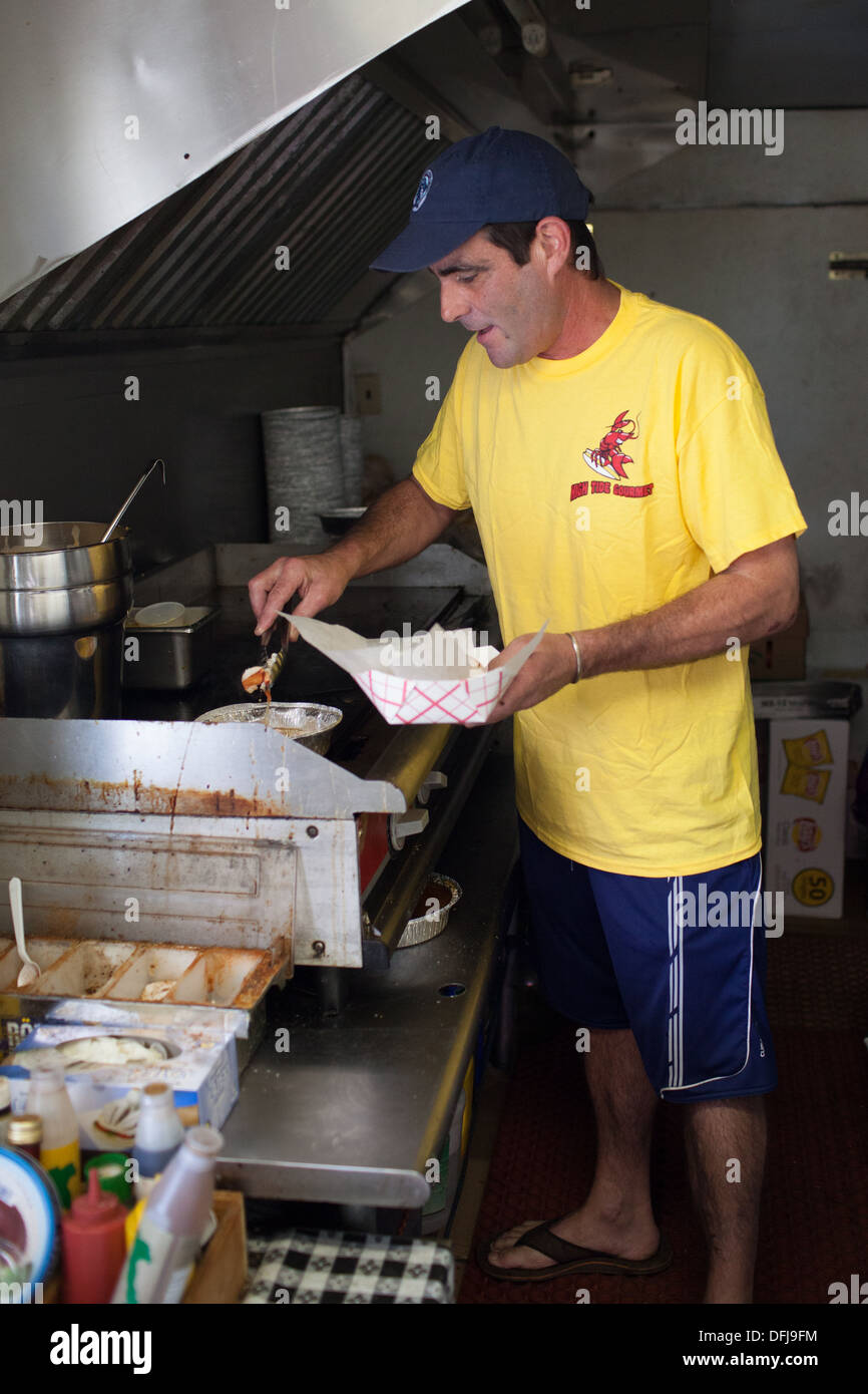 Richard Messier prepares a lobster roll on his High Tide Lobster Food ...
