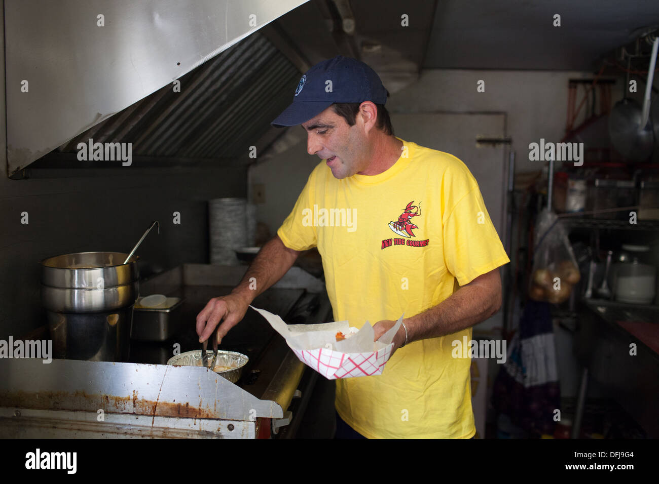 Richard Messier prepares a lobster roll on his High Tide Lobster Food ...
