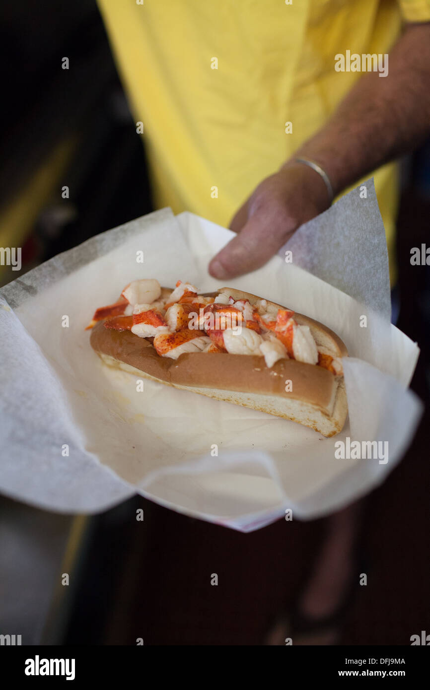 Richard Messier prepares a lobster roll on his High Tide Lobster Food ...