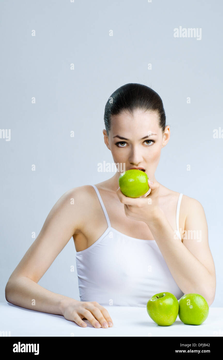 A beautiful slender girl eating healthy food Stock Photo - Alamy