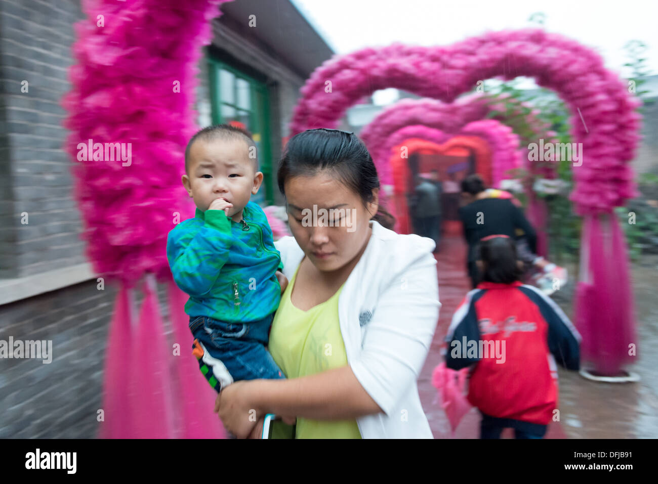Child china rain hi-res stock photography and images - Alamy