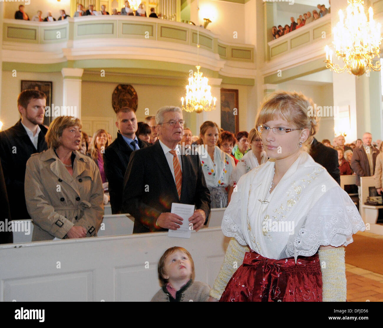 Straupitz, Germany. 06th Oct, 2013. A woman in a Wendish costume walks ...