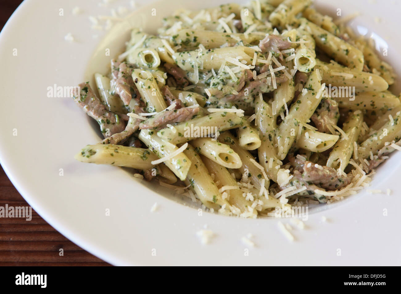 A serving of Penne pasta with herbs, beef and cheese Stock Photo - Alamy