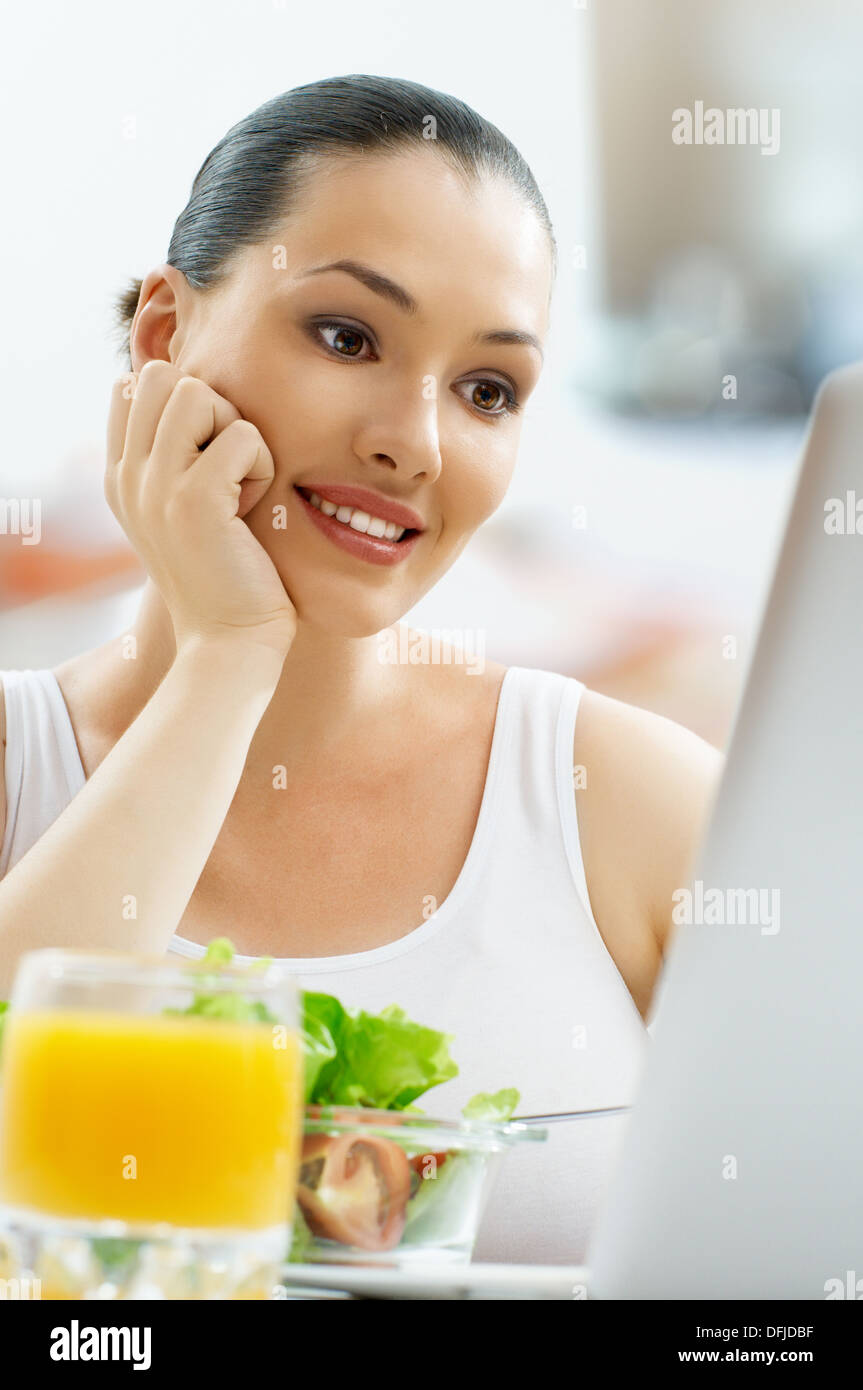 A beautiful slender girl eating healthy food Stock Photo - Alamy