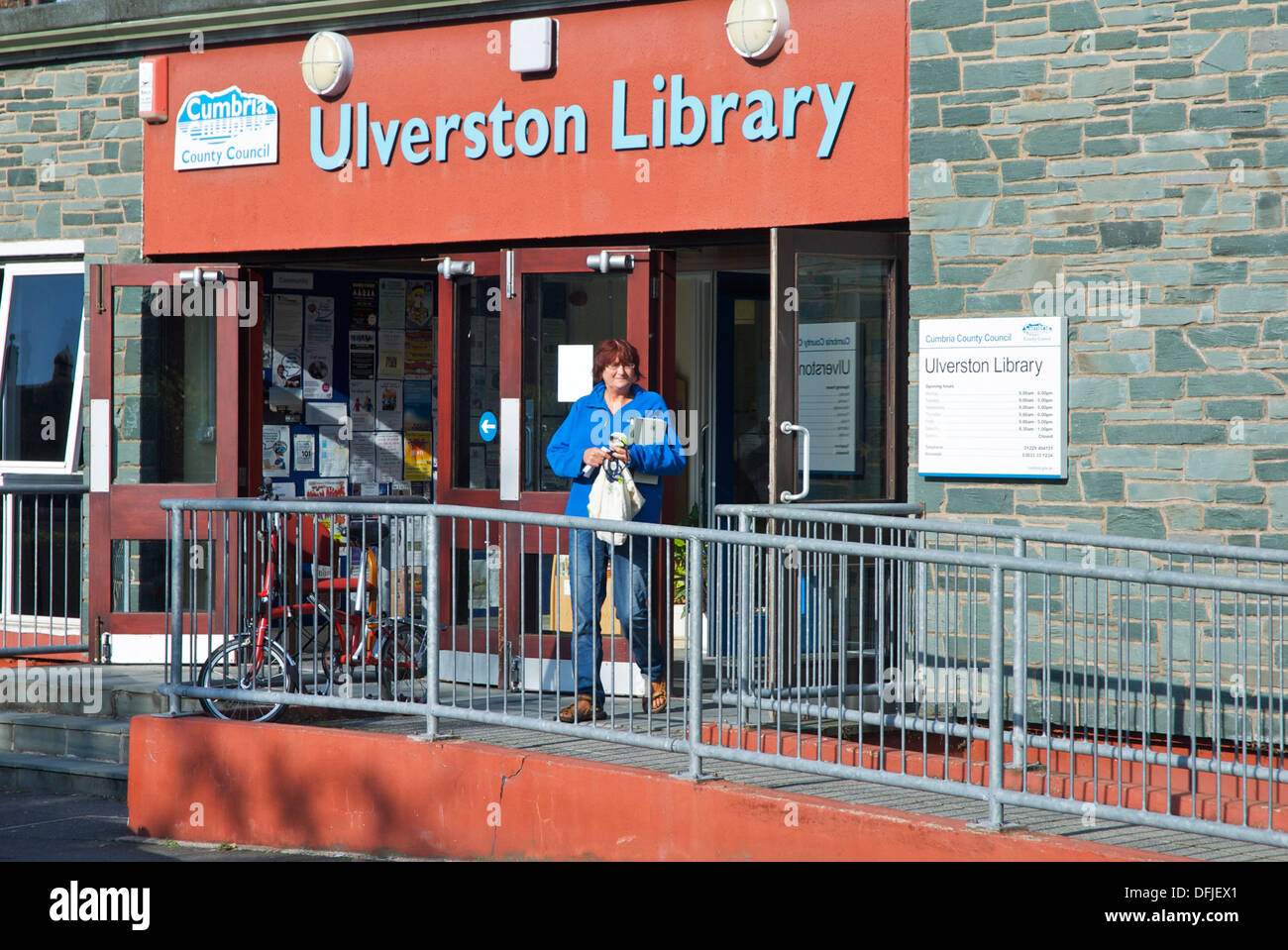 Woman walking out of the door hi-res stock photography and images - Alamy