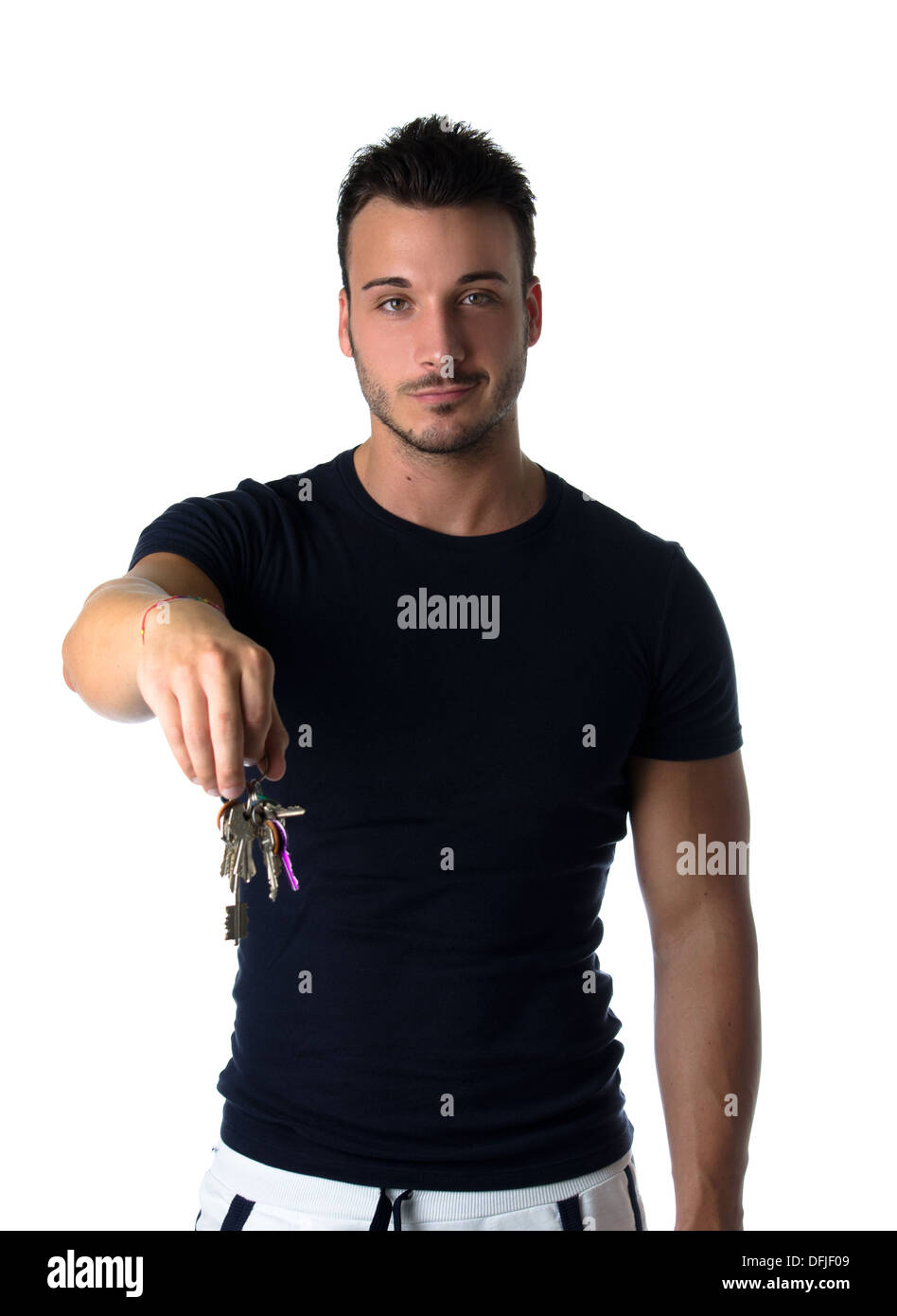 Attractive young man standing, holding a bunch of keys, isolated Stock ...