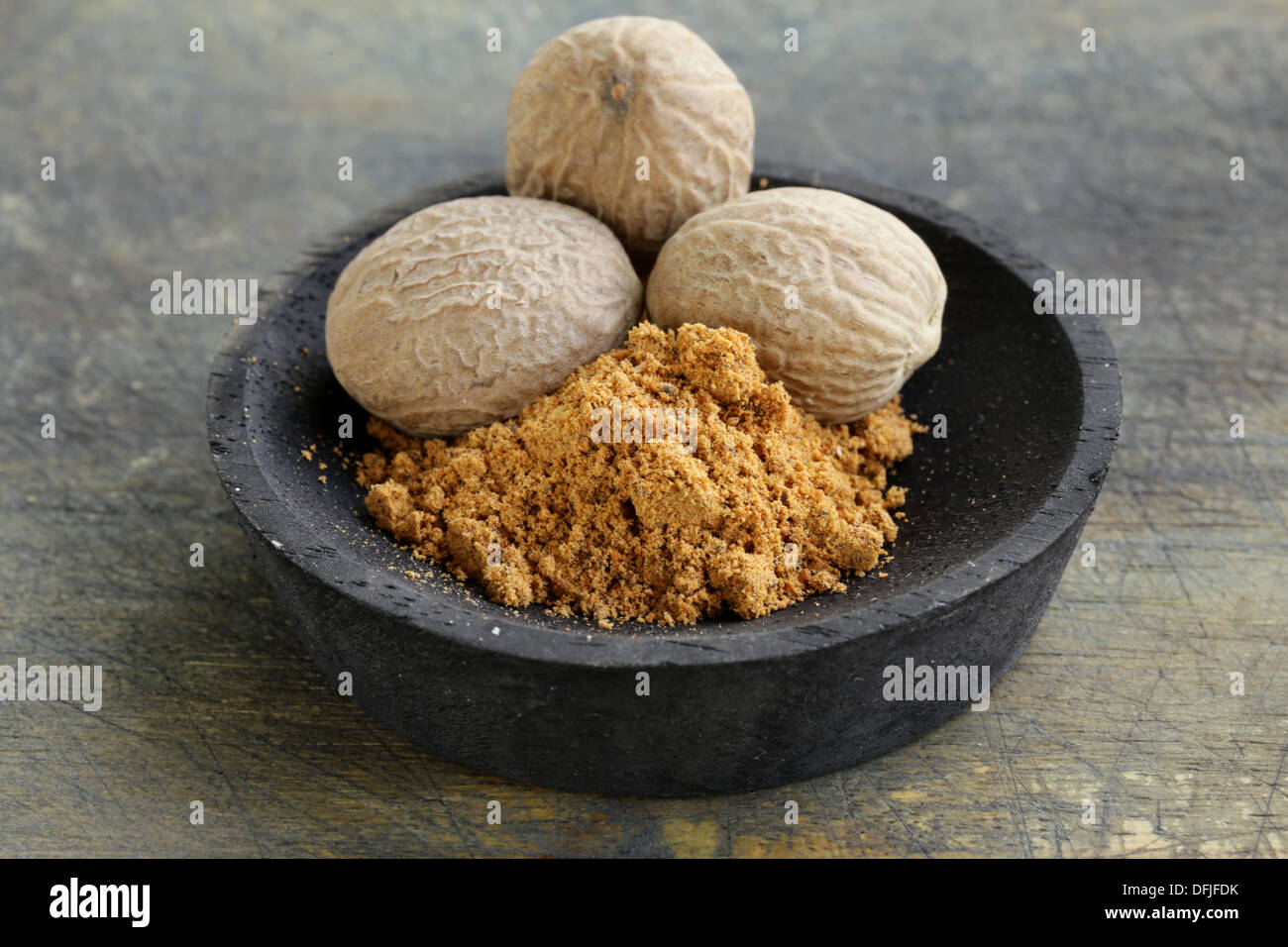 Nutmeg in wooden bowl hi-res stock photography and images - Alamy
