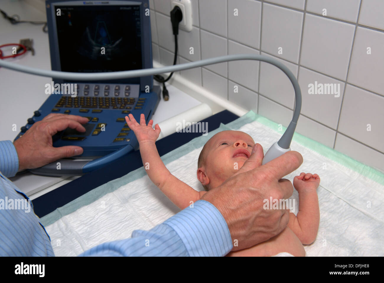 Doctor using a Fujifilm SonoSite MicroMaxx portable ultrasound machine ...