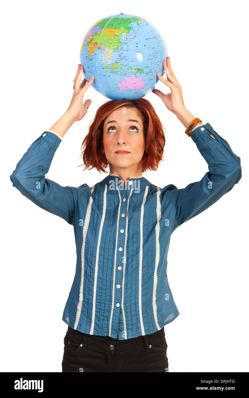 Executive woman holding world globe overhead and looking up isolated on ...