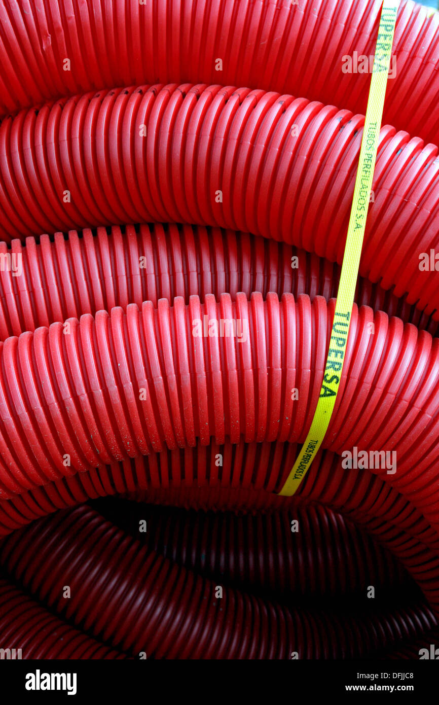 Red pipe, construction material Stock Photo - Alamy