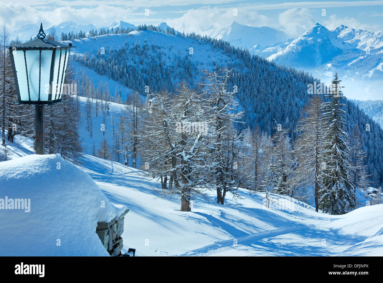 Winter hazy veiw from Dachstein mountain massif (Austria) and lamp near ...