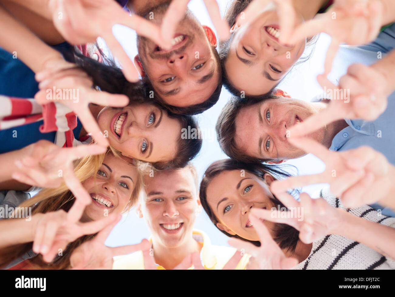 group of teenagers showing finger five gesture Stock Photo - Alamy