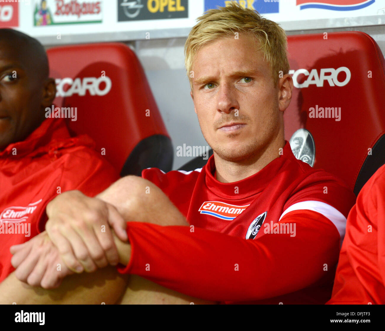 Freiburg, Germany. 06th Oct, 2013. Freiburg's Mike Hanke sits on the ...