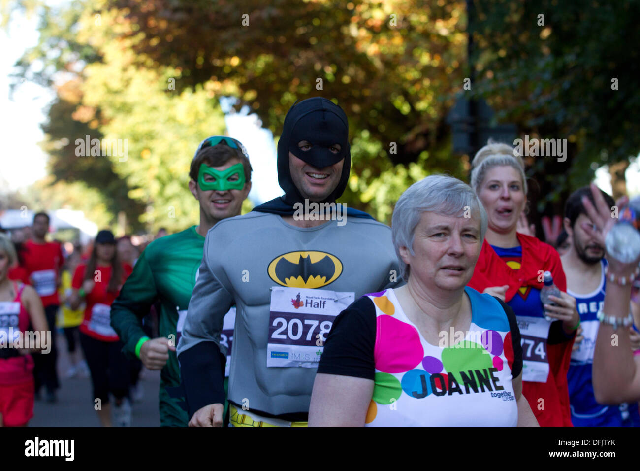 Hyde Park London, UK. 6th Oct, 2013. Runners in comic heroe costumes as ...