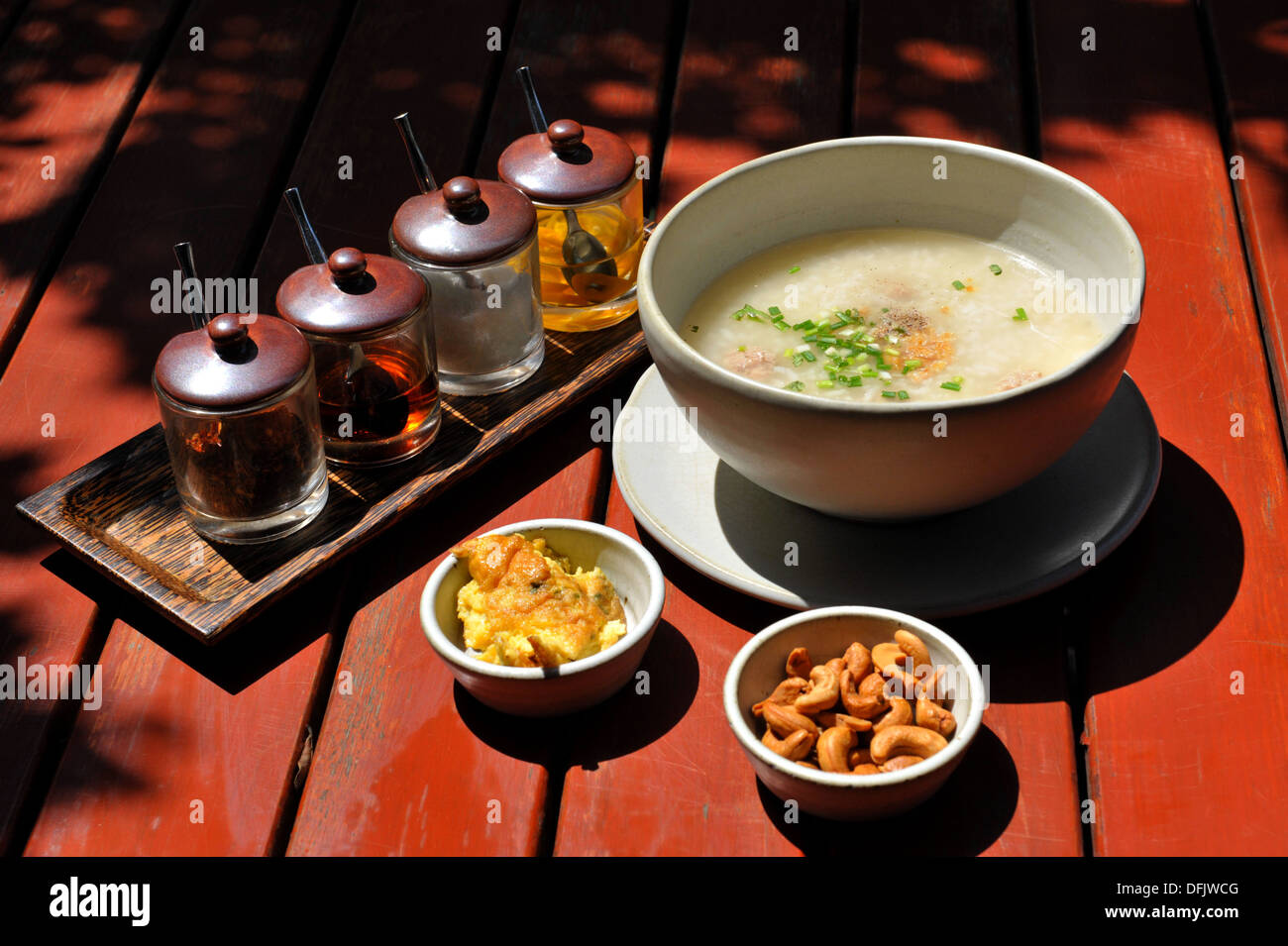 Taste of Thailand - A delicious bowl of porridge with Thai condiments ...