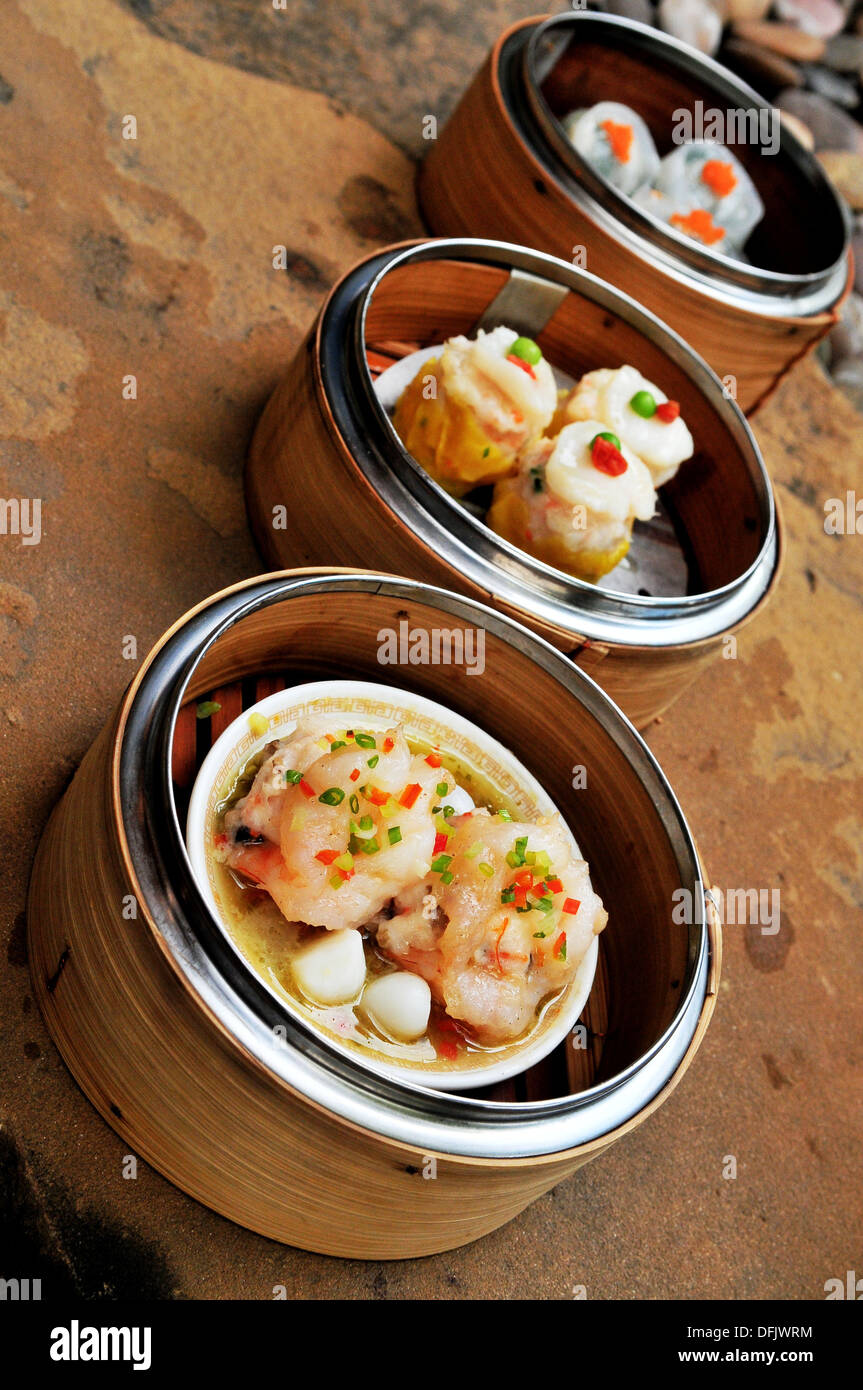 Taste of Thailand - Dim sum in round bamboo steam baskets Stock Photo ...