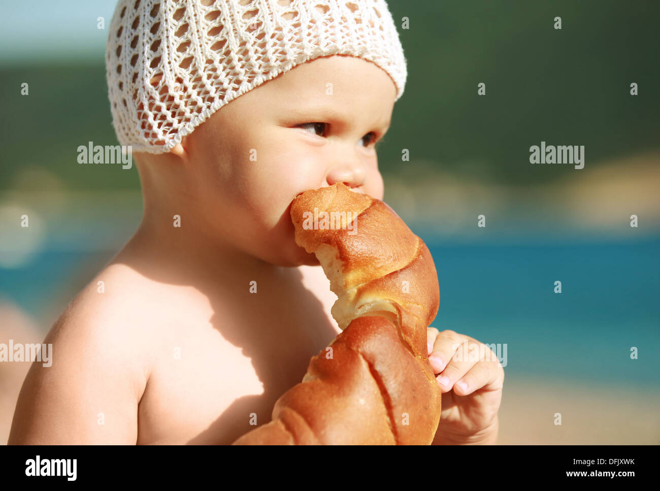 Child eating croissant hi-res stock photography and images - Alamy