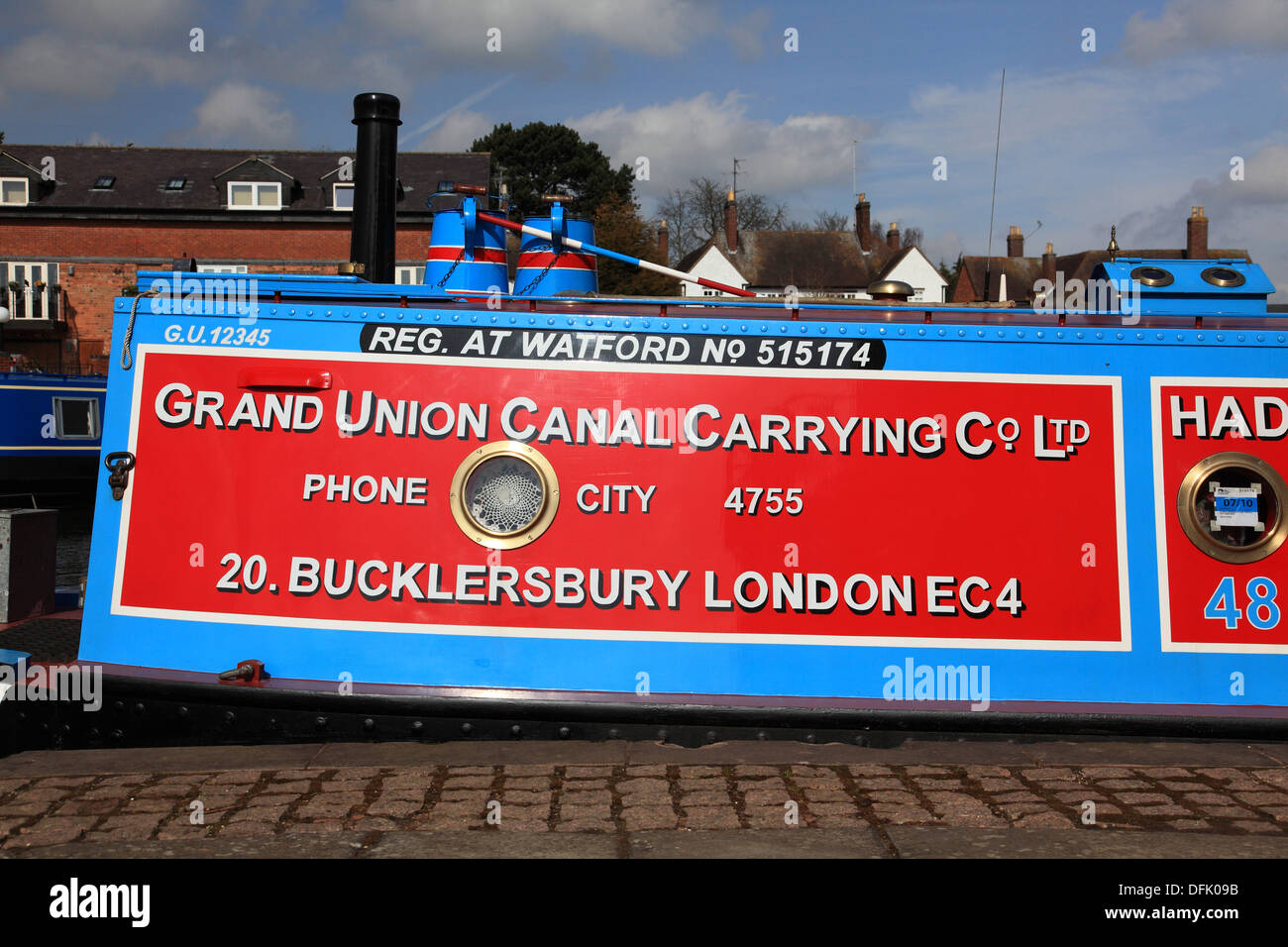 Coal carrying narrowboat moored in the regenerated canal basin at the ...