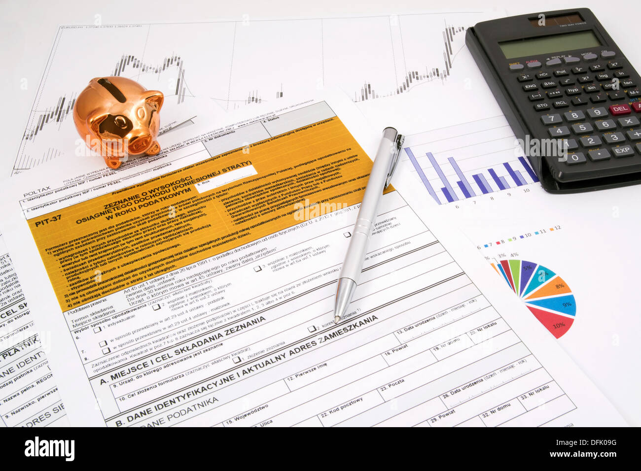 Polish income tax PIT-37 form with calculator and piggybank Stock Photo ...