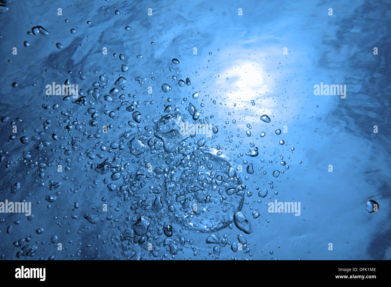Air bubbles rising to water surface with sunlight in background, natural scene, Caribbean sea ...