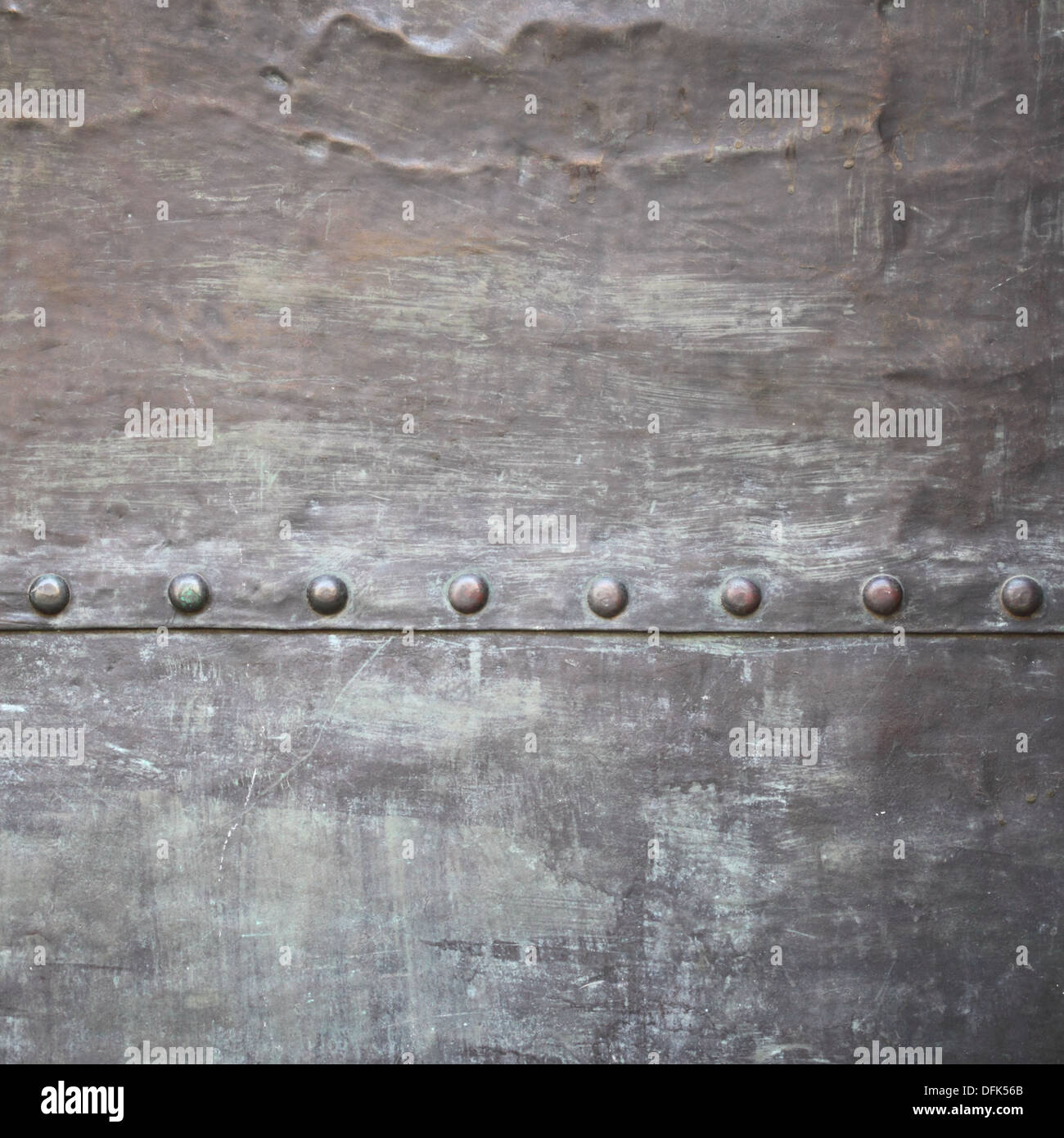 Black grunge metal plate or armour texture with rivets as background ...