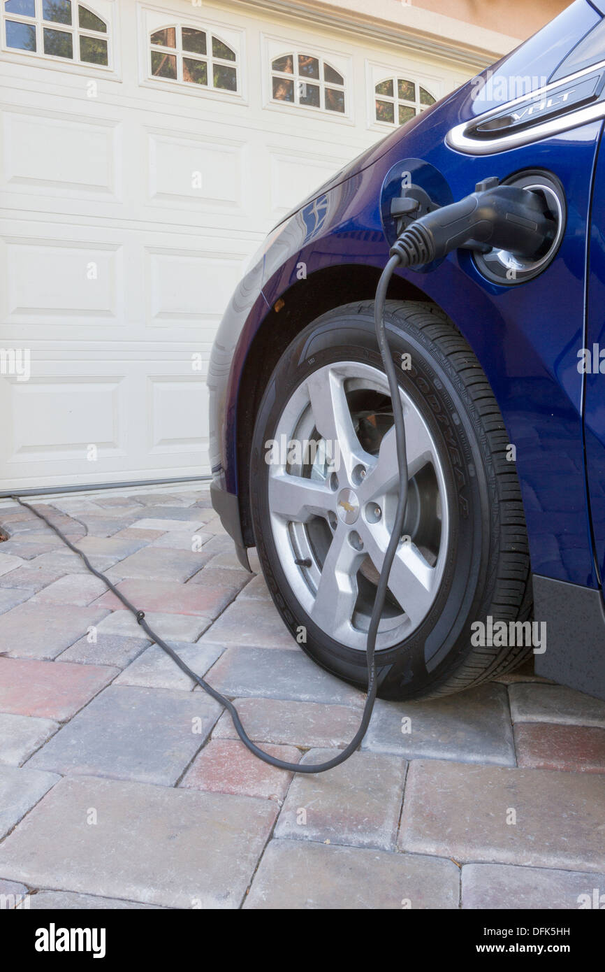 Chevrolet Volt plug-in hybrid electric car with connector plugged in ...