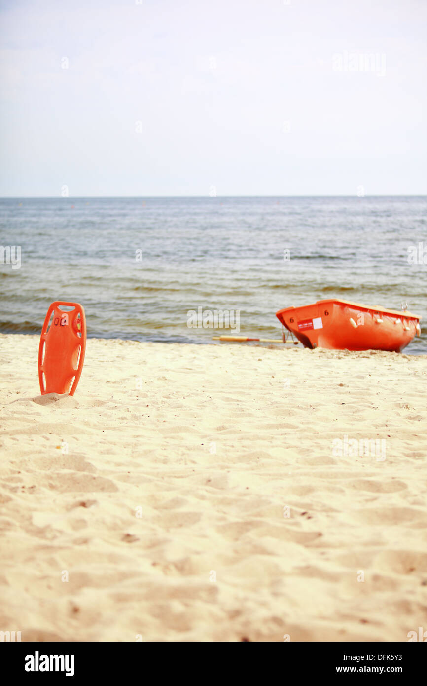 Beach life-saving. Lifeguard rescue equipment orange preserver tool and ...
