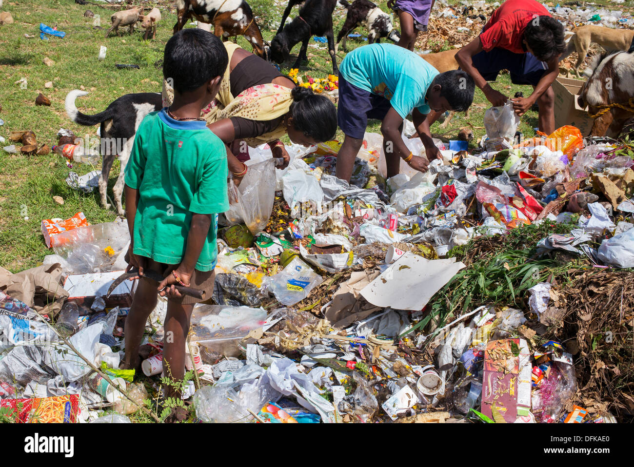 Poor Indian women and children collecting pickings from a rubbish Stock ...