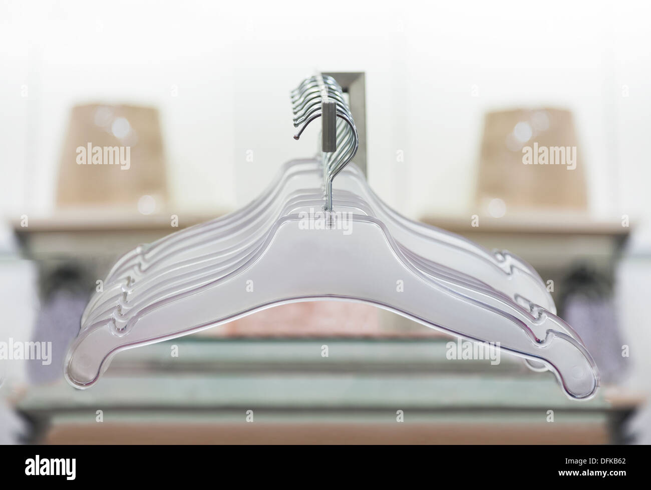 Close-up of empty hangers in retail shop Stock Photo - Alamy