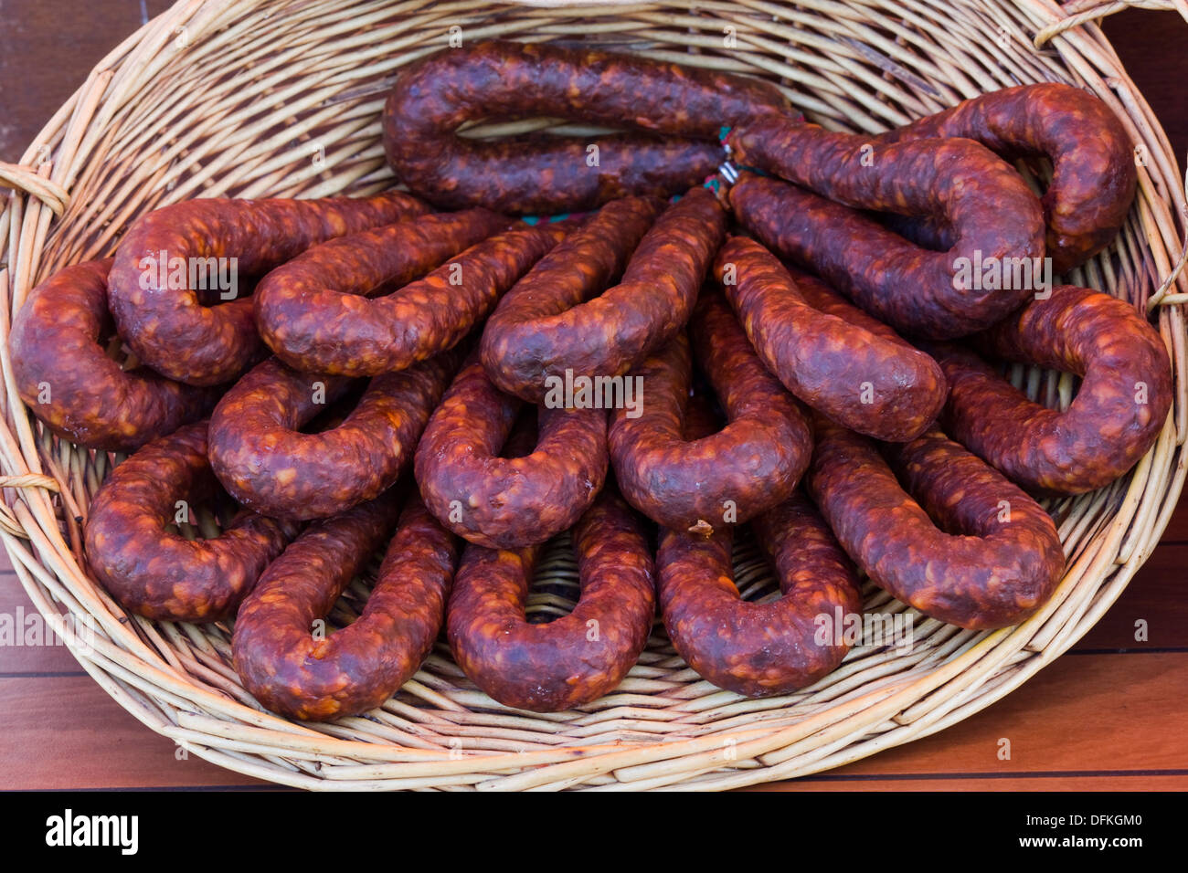 Display of Hot Chorizo in a Wicker Basket Stock Photo - Alamy