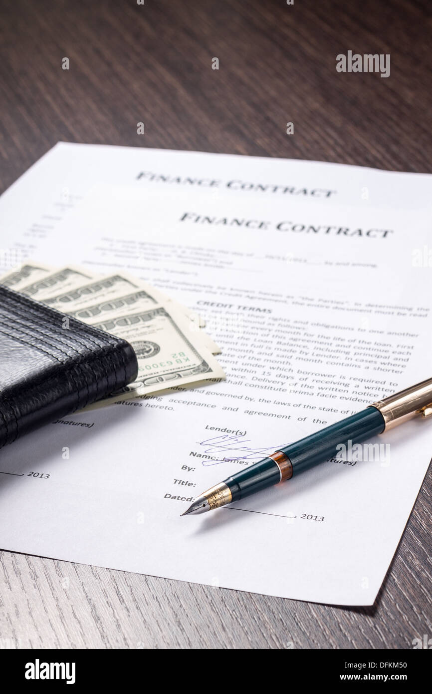 Financial document with wallet, money and ink pen Stock Photo - Alamy