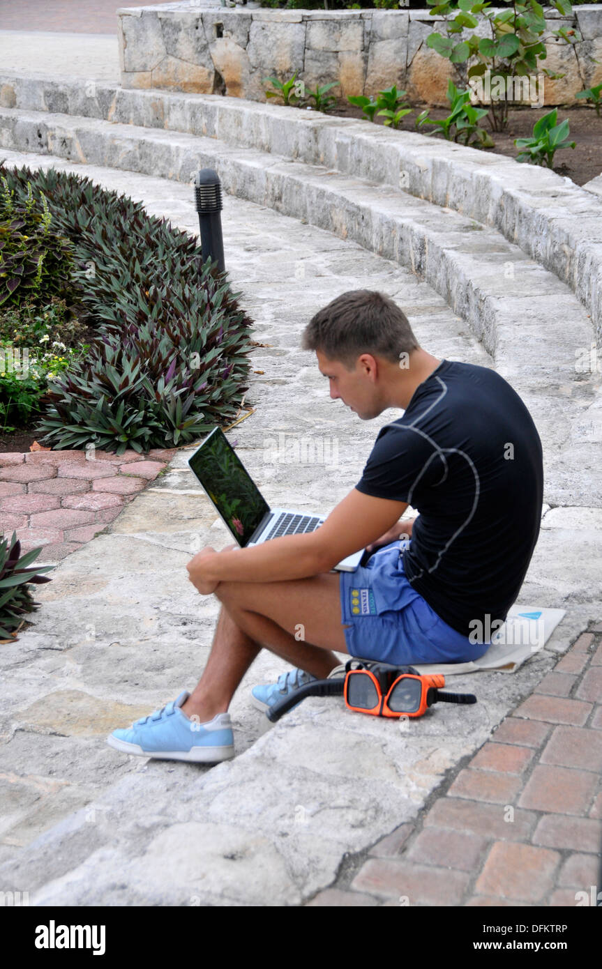 Tourist from Caribbean Cruise Ship uses wireless laptop computer in ...